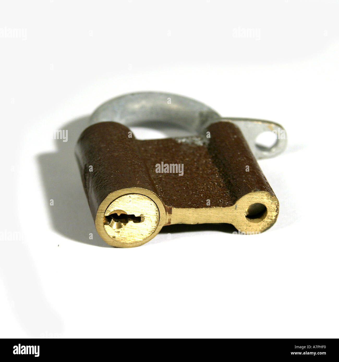 An old brass lock isolated on white Stock Photo - Alamy