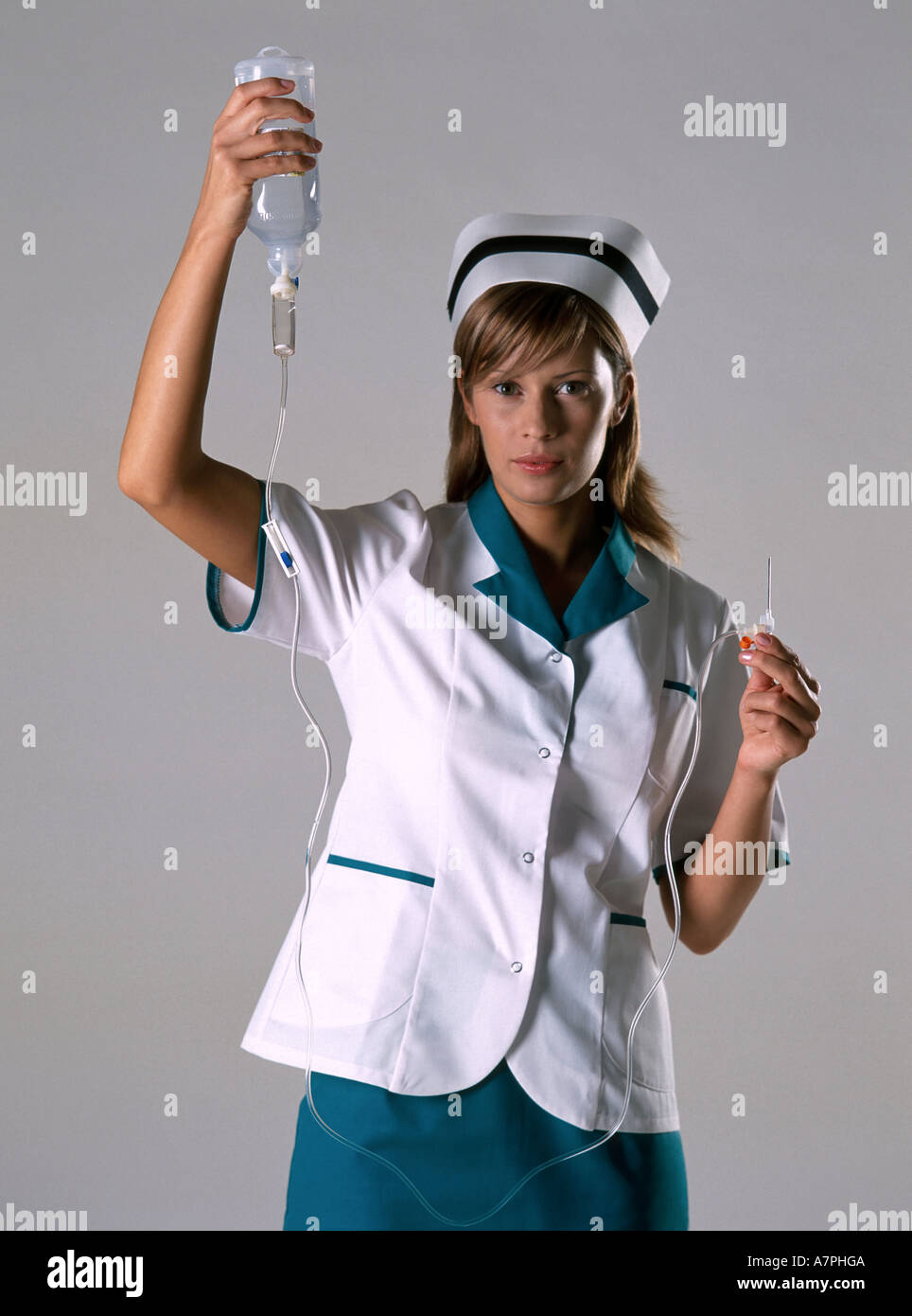 indoor studio medicine woman young 20 25 girl blonde nurse cap stripe ...