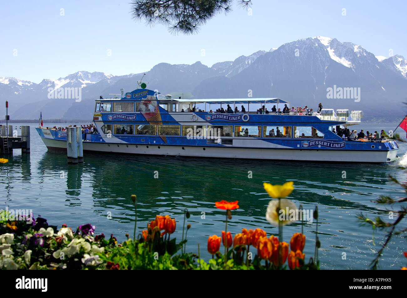Excursion ship on Lake Geneva at the shipping pier Montreux and the ...