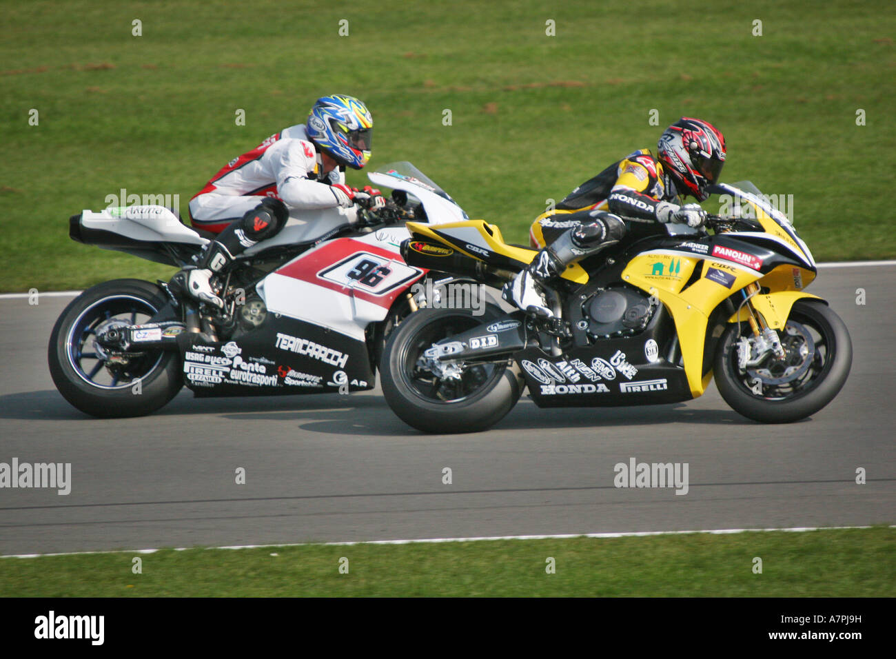 Racing motorcycle and rider in competition at high speed at Donnington ...