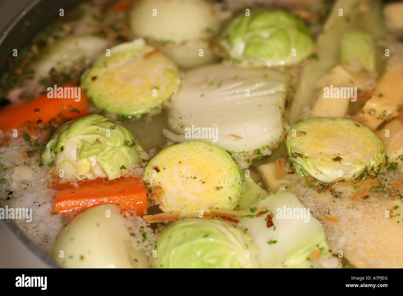 Mixed prepared vegetables being boiled in water in a pan Stock Photo ...