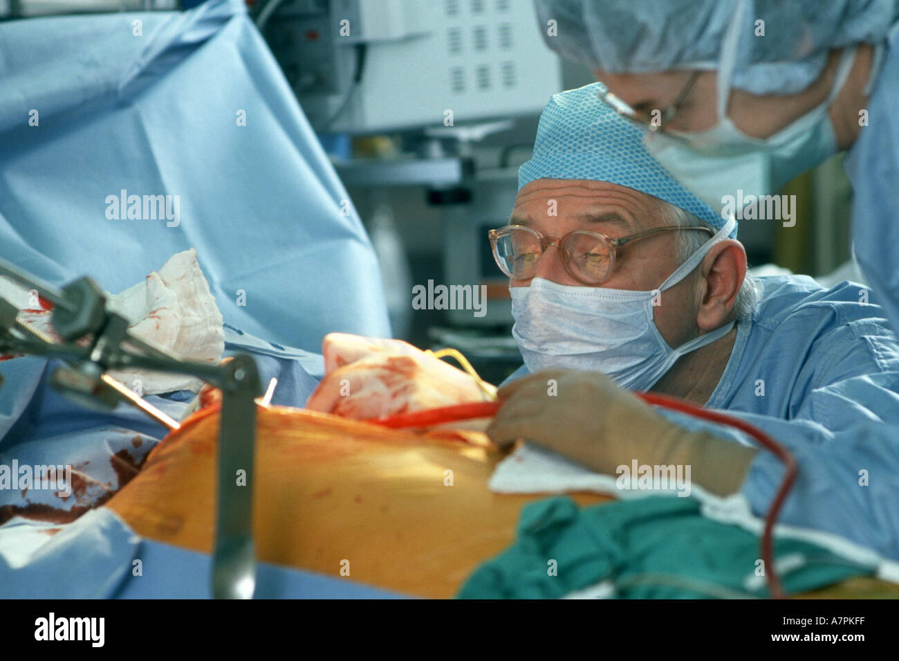 Surgeon and nurses during hospital operation hi-res stock photography ...