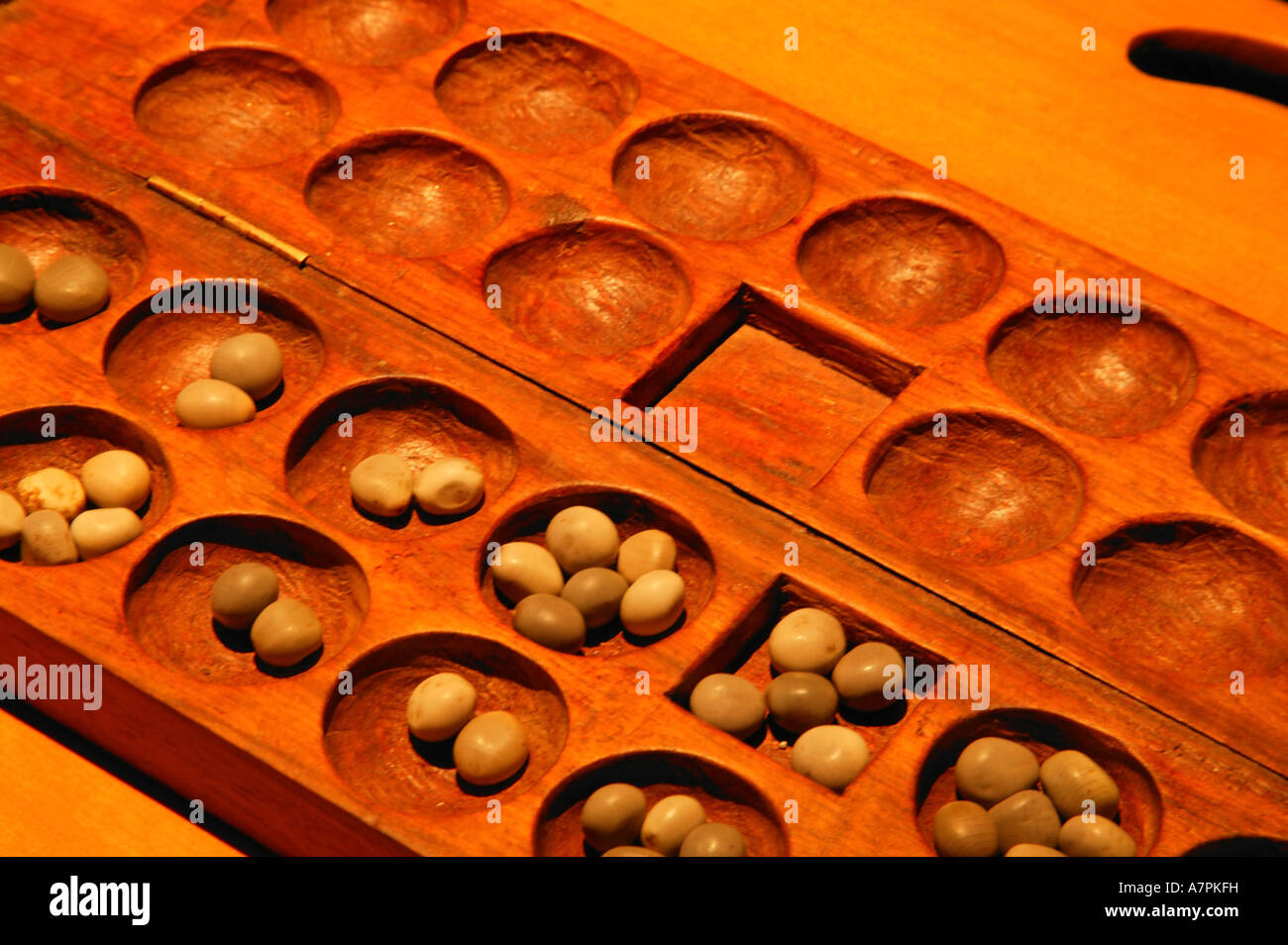 A wooden bao game board a traditional East African game Namibrand ...