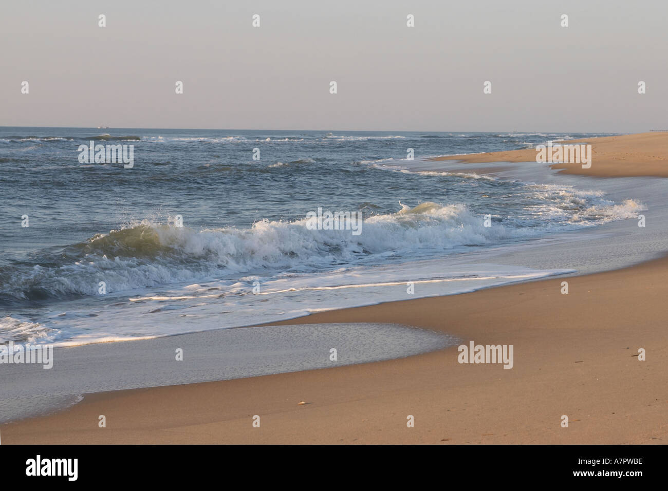 Waves along the beach Stock Photo - Alamy