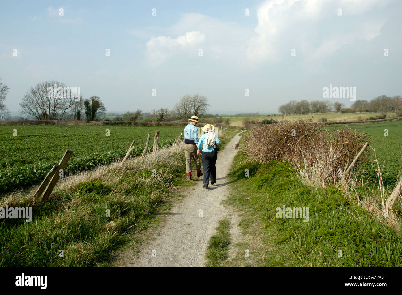 Two people walking in countryside, UK Stock Photo - Alamy