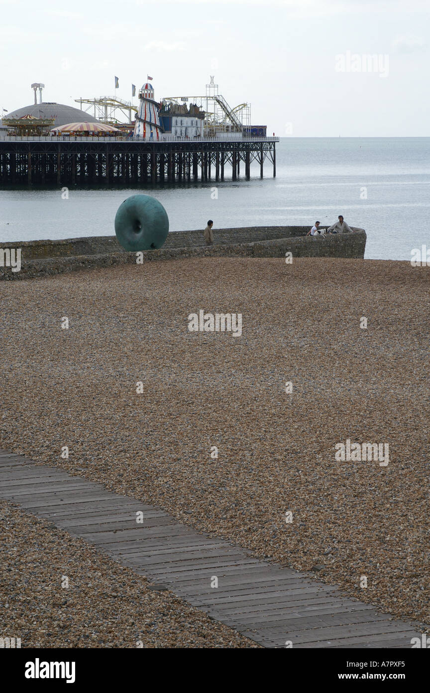 The seafront and pebble beach next to the palace pier Brighton Stock ...