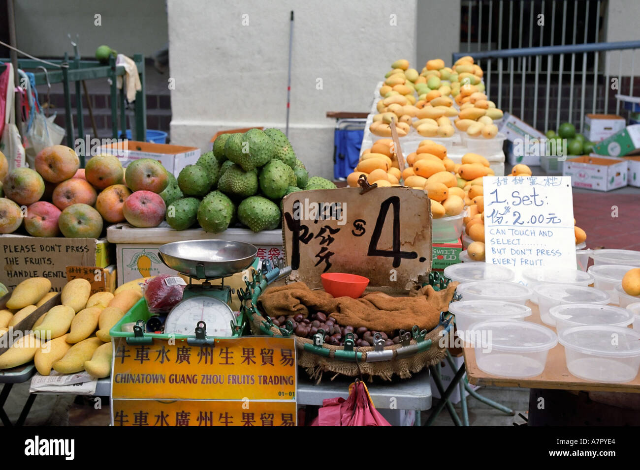 Fruit stall with mangoes at the street market. Chinatown. Singapore ...