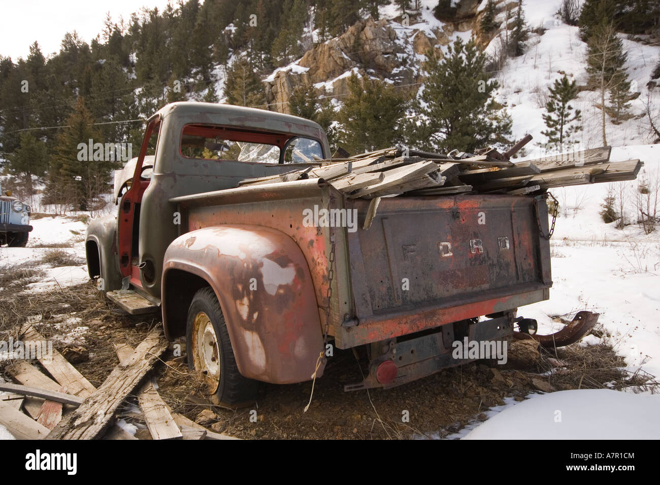Rusty old car in open air in Colorado USA in snow and ice. Broken old ...