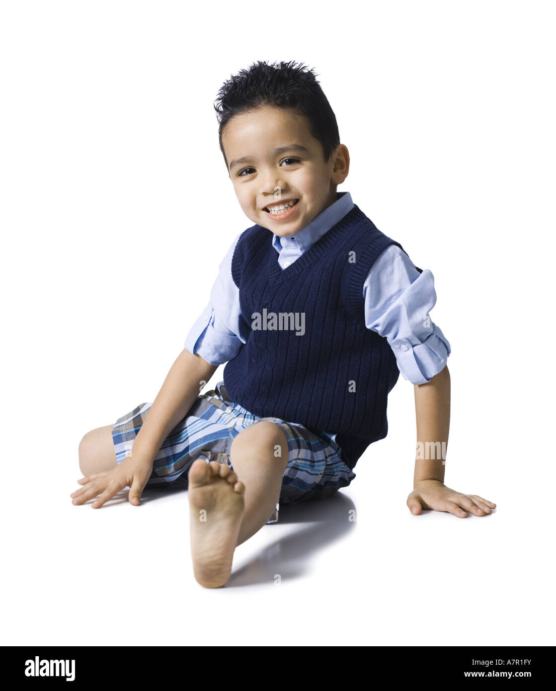 Boy sitting and smiling Stock Photo - Alamy