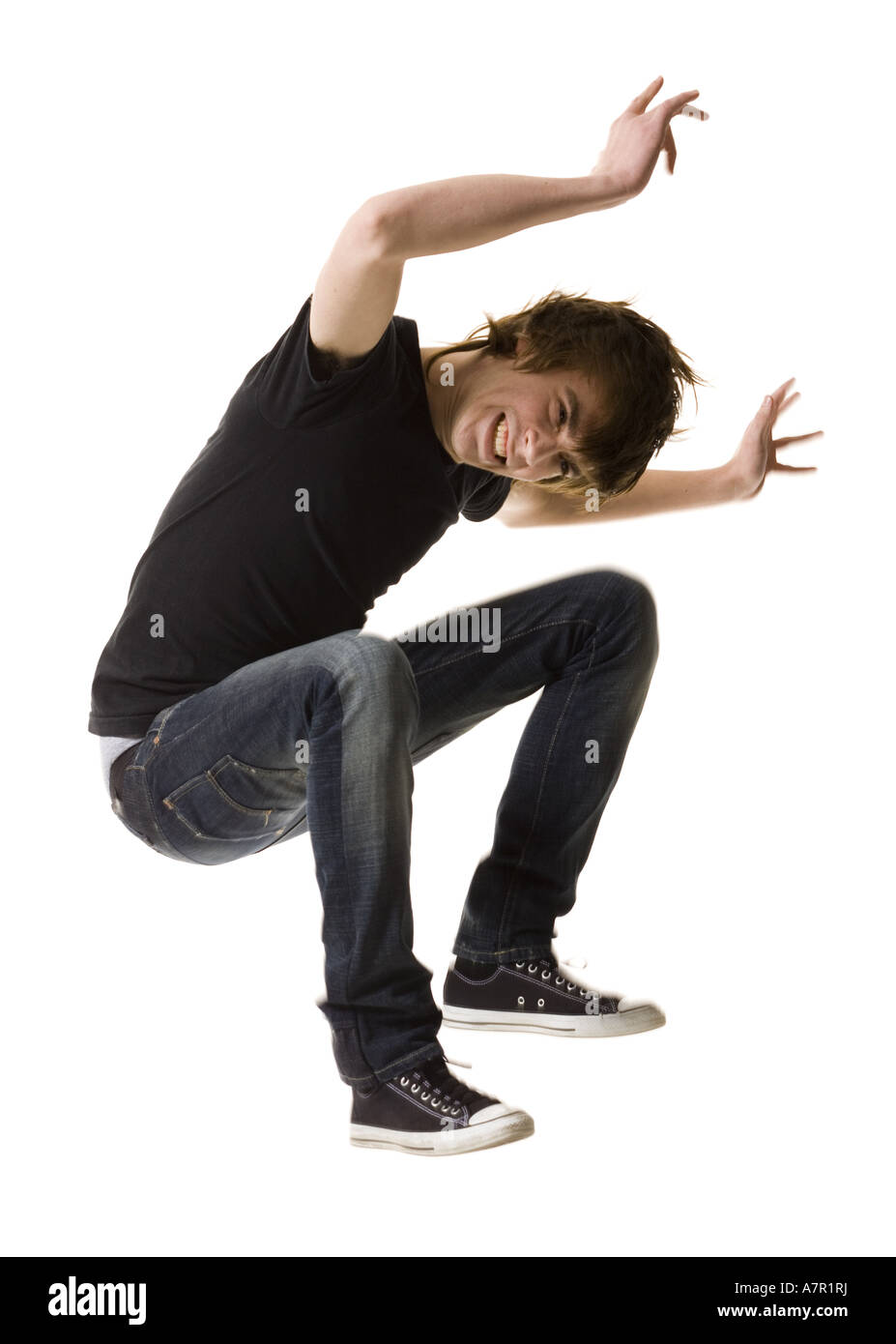 Teenage boy leaping Stock Photo - Alamy