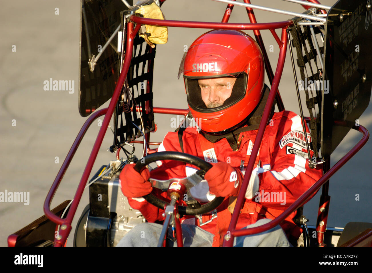 Kids and Dads racing small carts Stock Photo - Alamy