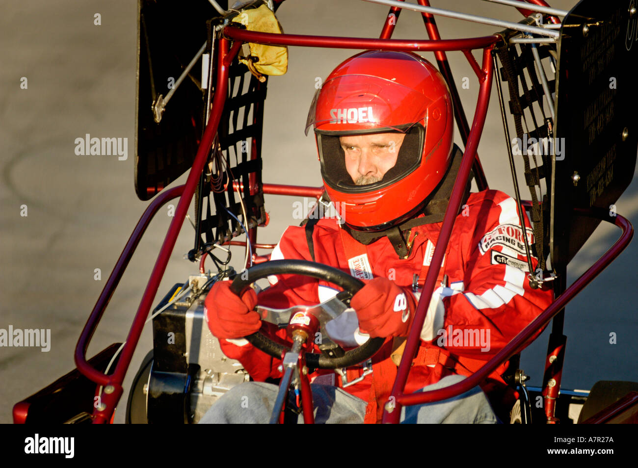 Kids and Dads racing small carts Stock Photo - Alamy