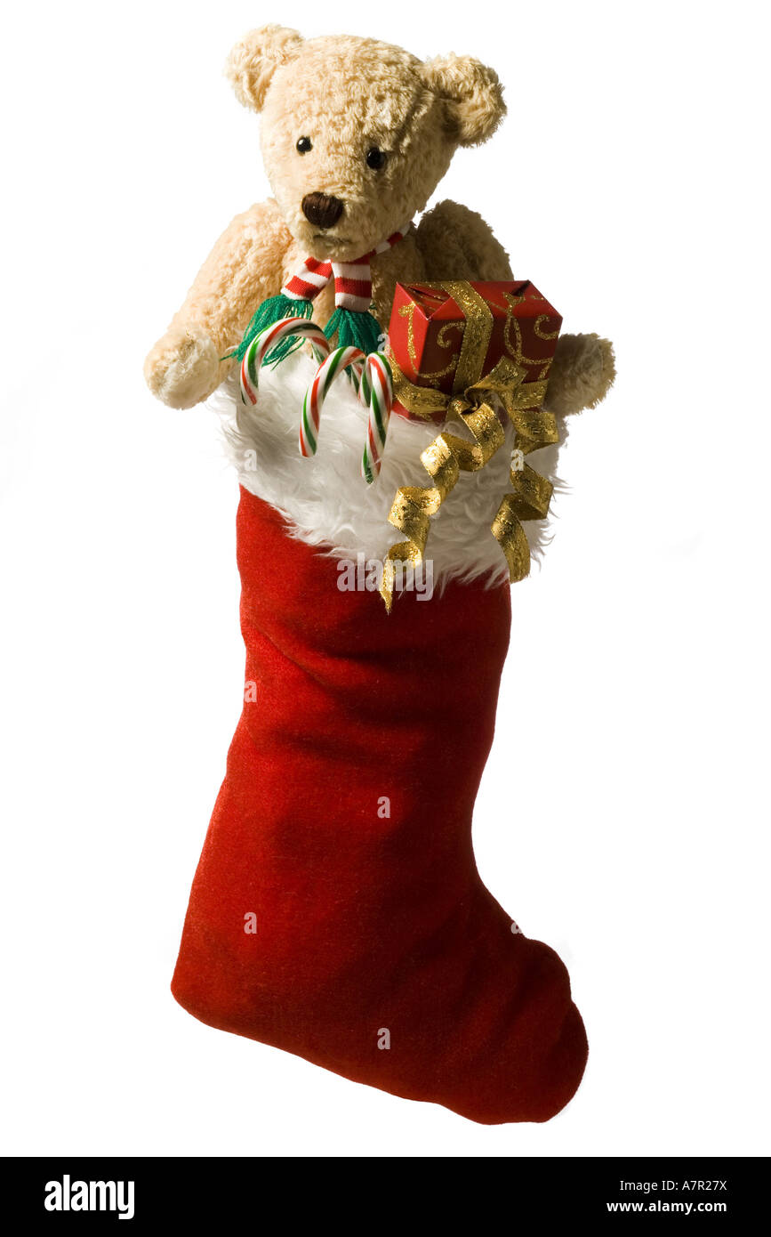 Christmas stocking with teddy bear and candy canes Stock Photo - Alamy