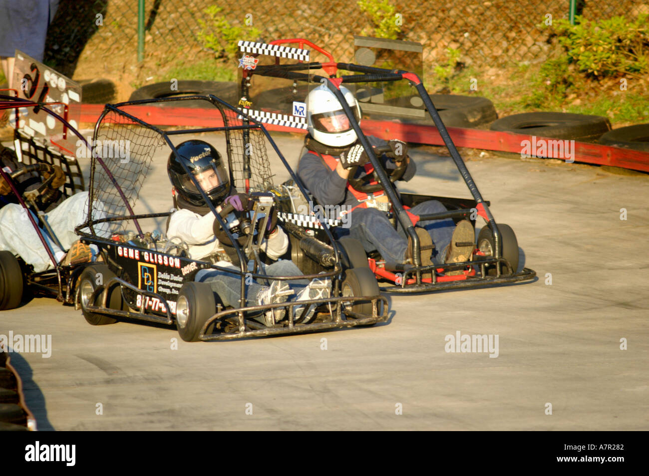 Kids and Dads racing small carts Stock Photo - Alamy