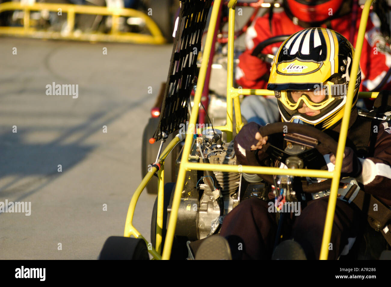 Kids and Dads racing small carts Stock Photo - Alamy