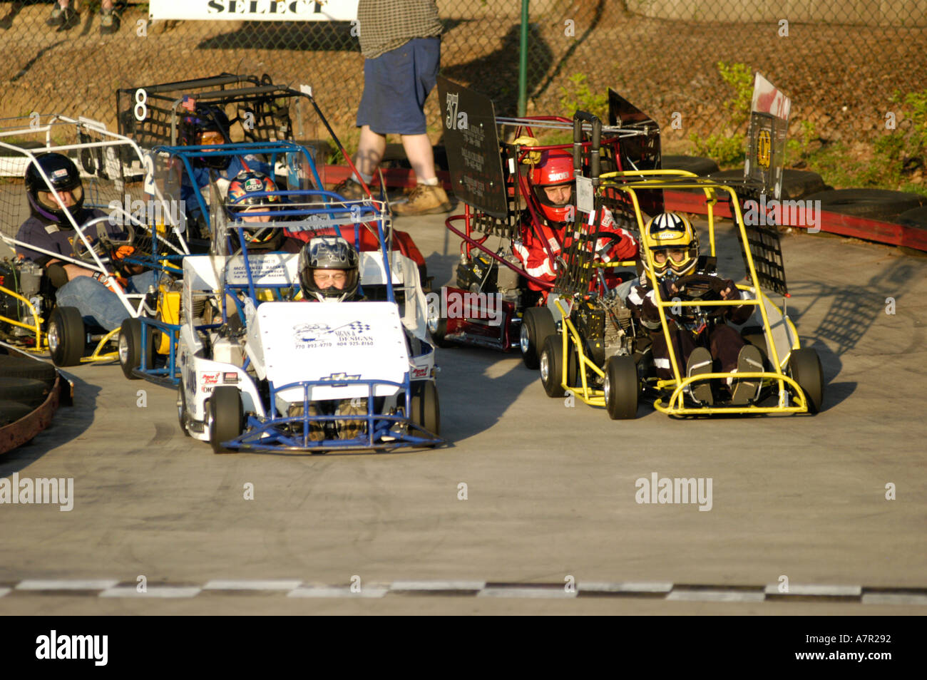 Kids and Dads racing small carts Stock Photo - Alamy