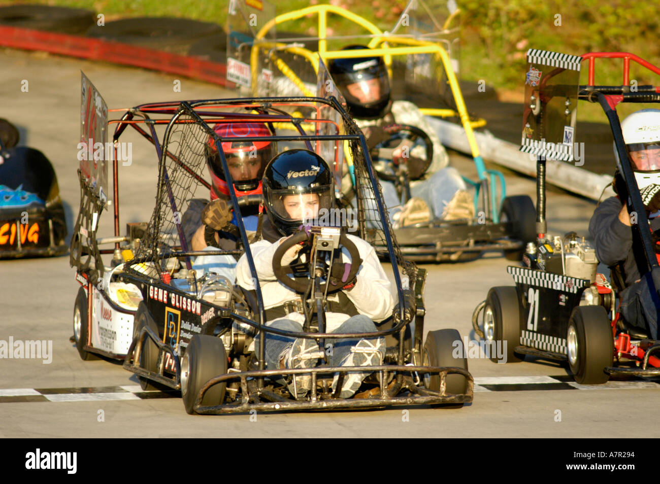 Kids and Dads racing small carts Stock Photo - Alamy