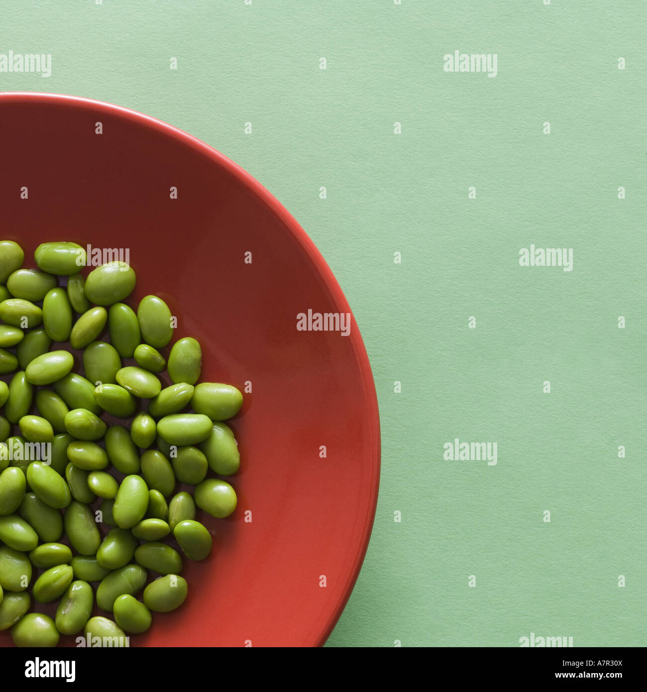 Lima beans in red bowl Stock Photo - Alamy