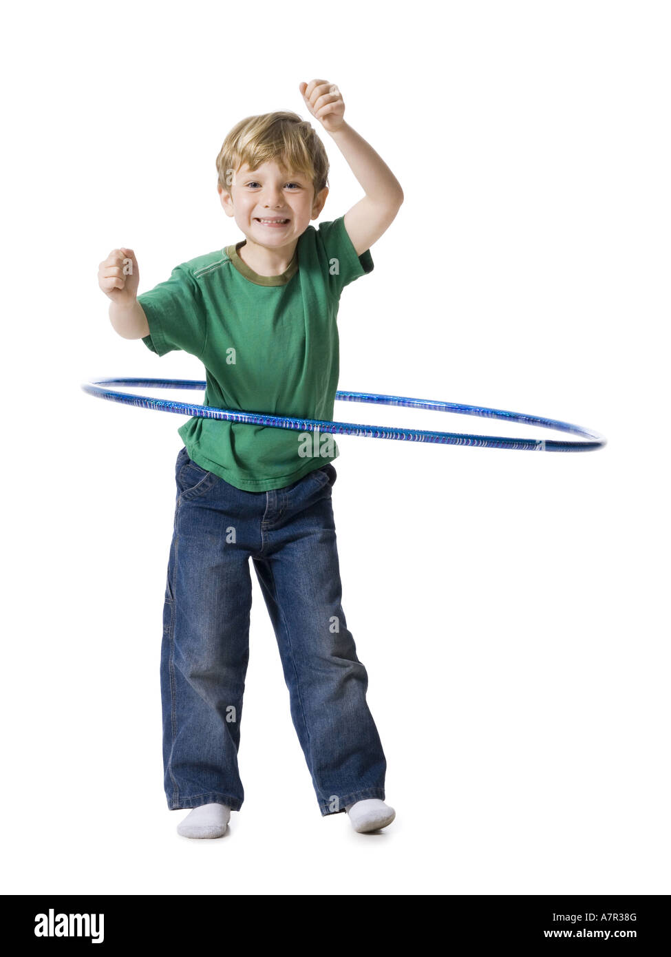 Boy playing with hula hoop Stock Photo - Alamy