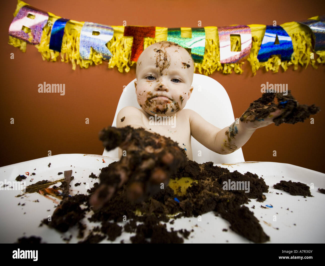Baby eating birthday cake Stock Photo - Alamy