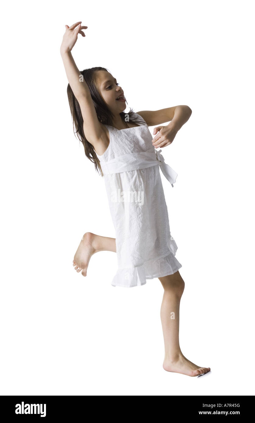 Girl in white dress dancing Stock Photo - Alamy