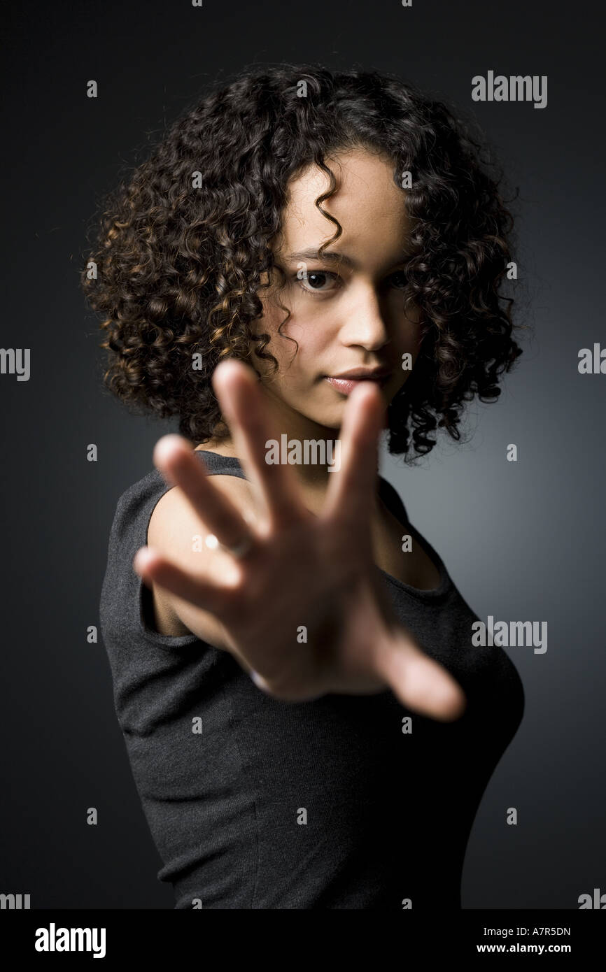 Woman reaching hand toward camera Stock Photo - Alamy