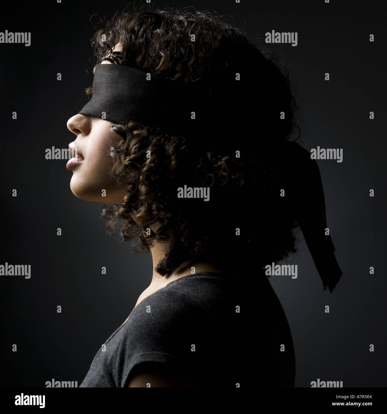 Profile of a blindfolded woman Stock Photo - Alamy
