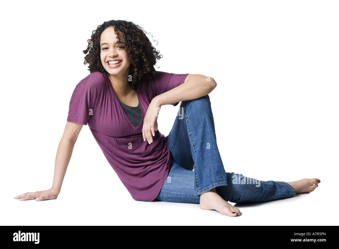 Woman sitting and smiling Stock Photo - Alamy