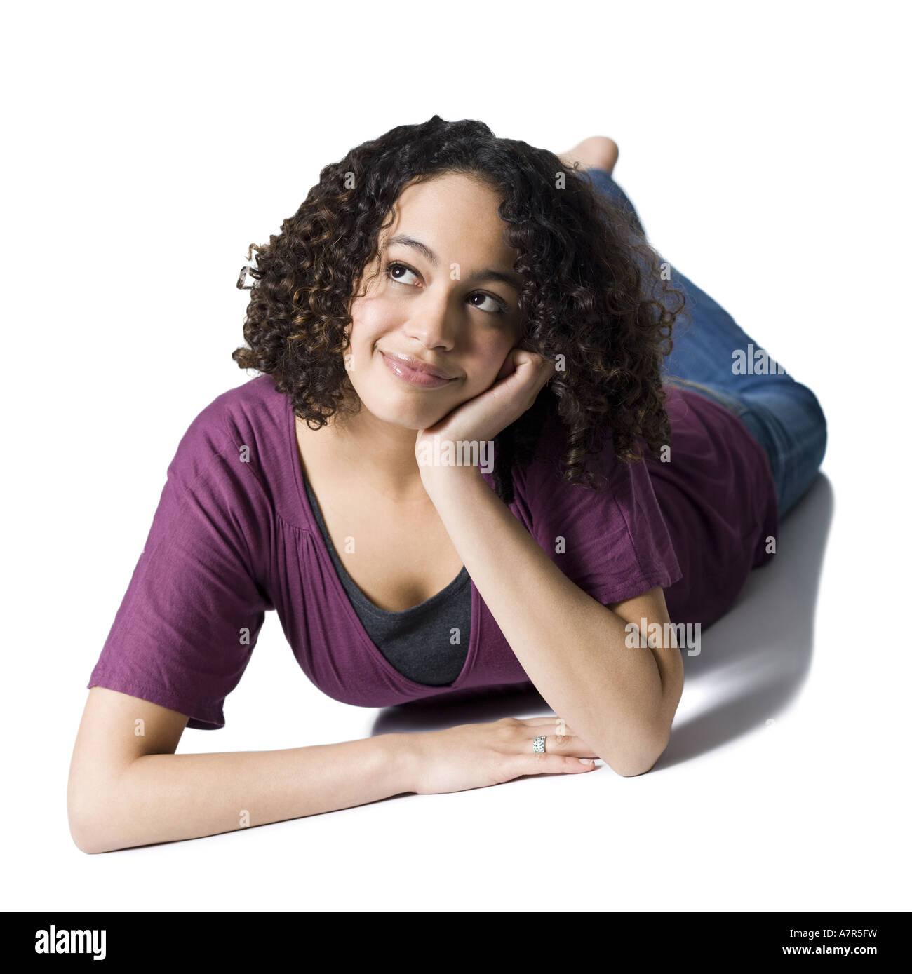 Woman reclining and smiling Stock Photo - Alamy