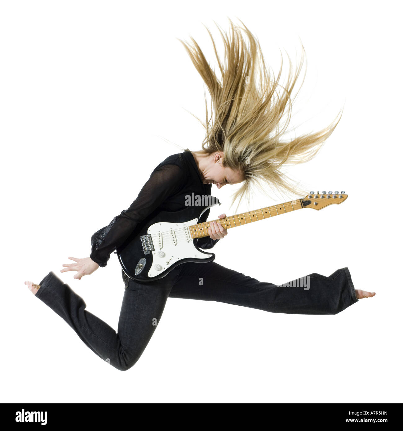 Profile of woman jumping with electric guitar Stock Photo - Alamy