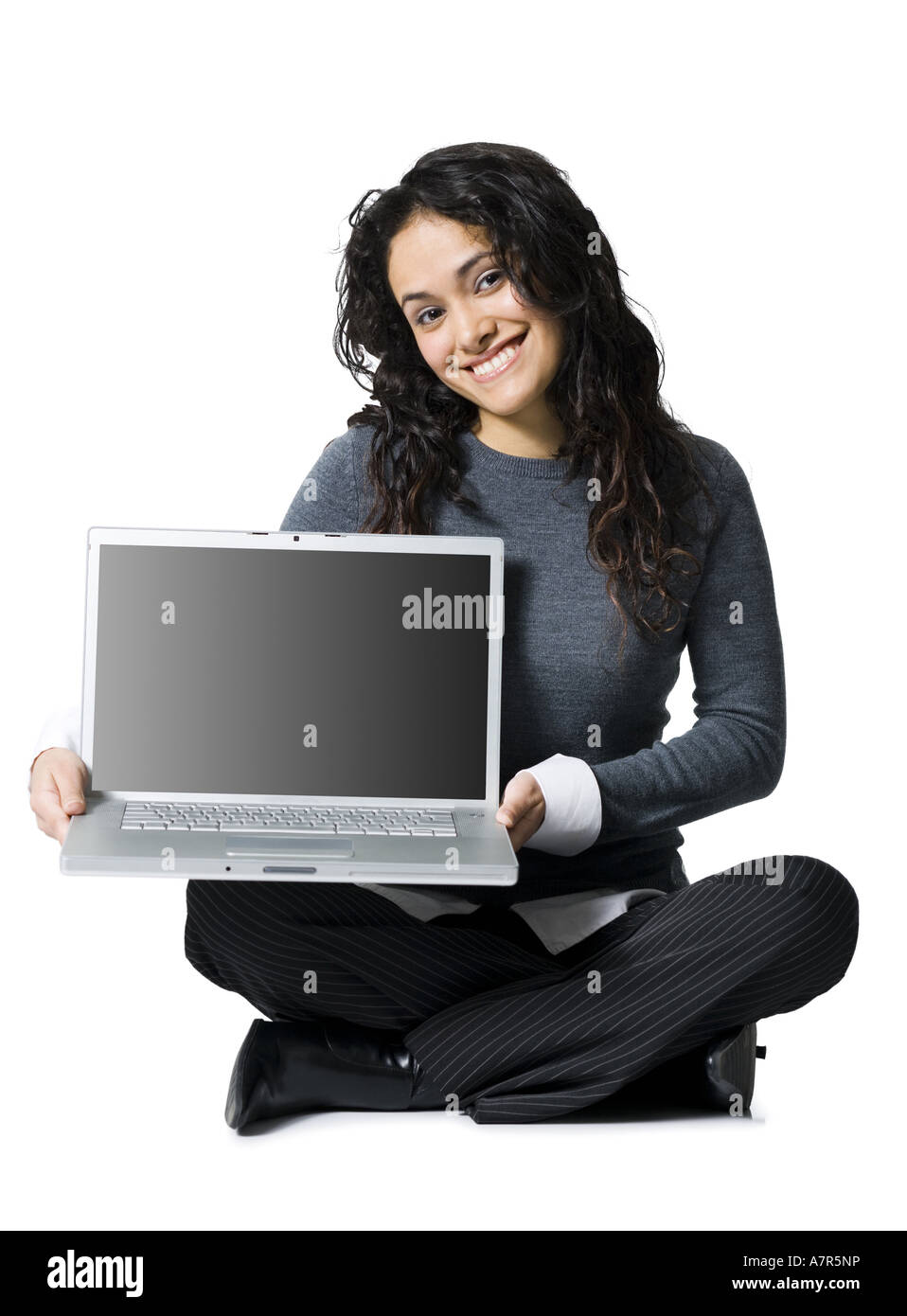 Woman sitting cross legged with laptop Stock Photo - Alamy