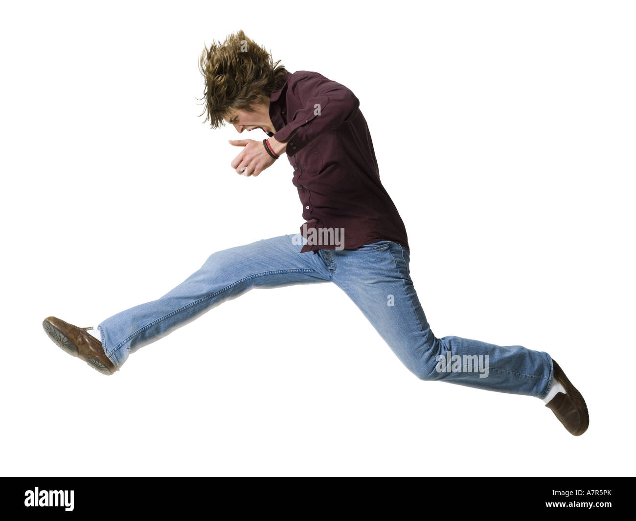 Side profile of boy jumping Stock Photo - Alamy