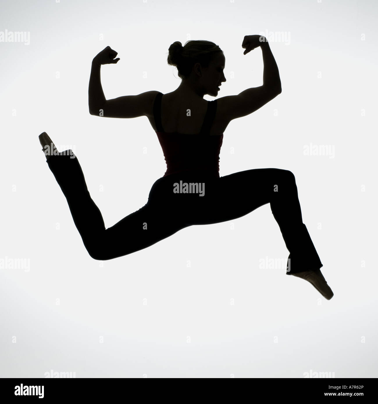 Side profile silhouette of female dancer flexing muscles Stock Photo ...
