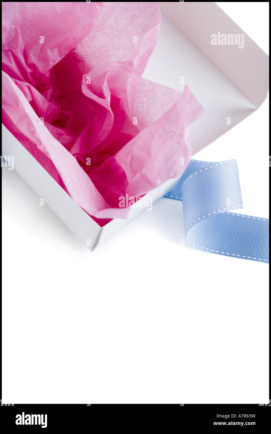 Empty candy box with tissue and ribbon Stock Photo - Alamy