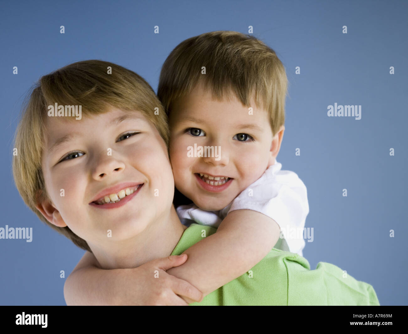 Boy giving boy piggyback ride Stock Photo - Alamy