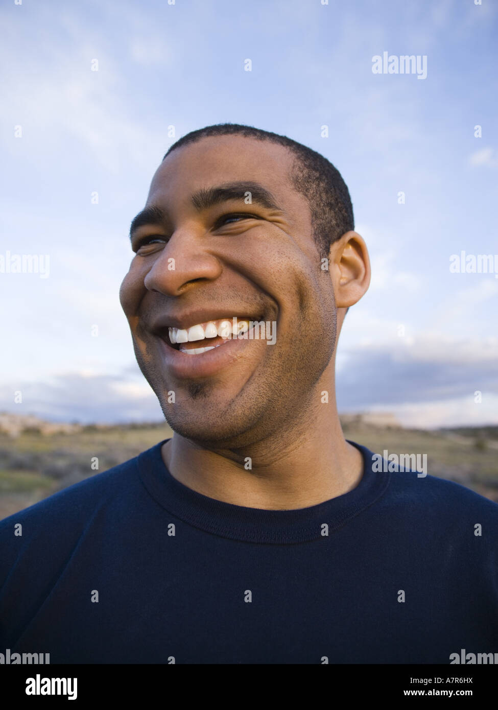 Man smiling outdoors Stock Photo - Alamy