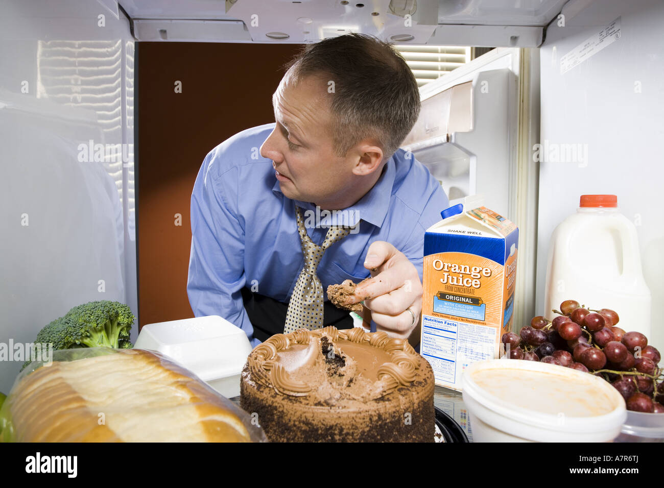 Sneaking food from the fridge hi-res stock photography and images - Alamy