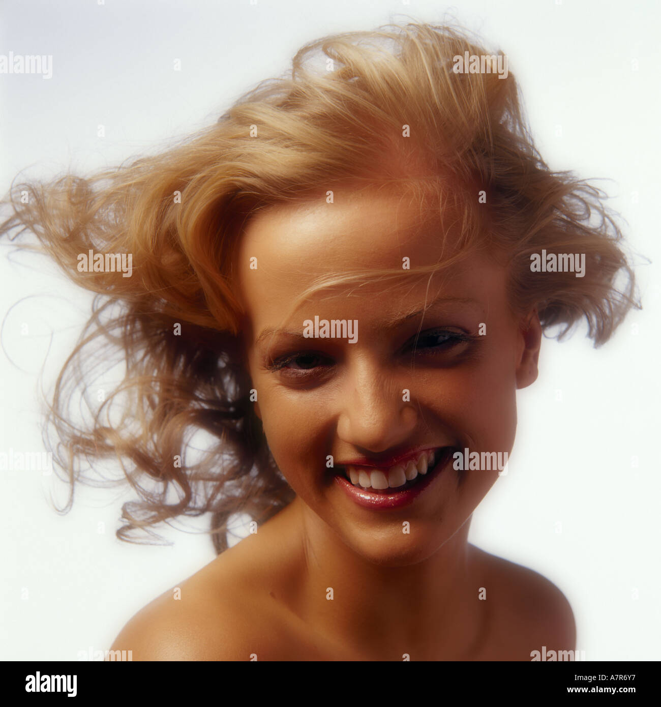 indoors studio woman young girl 20 25 blonde long hair curly curl curls ...