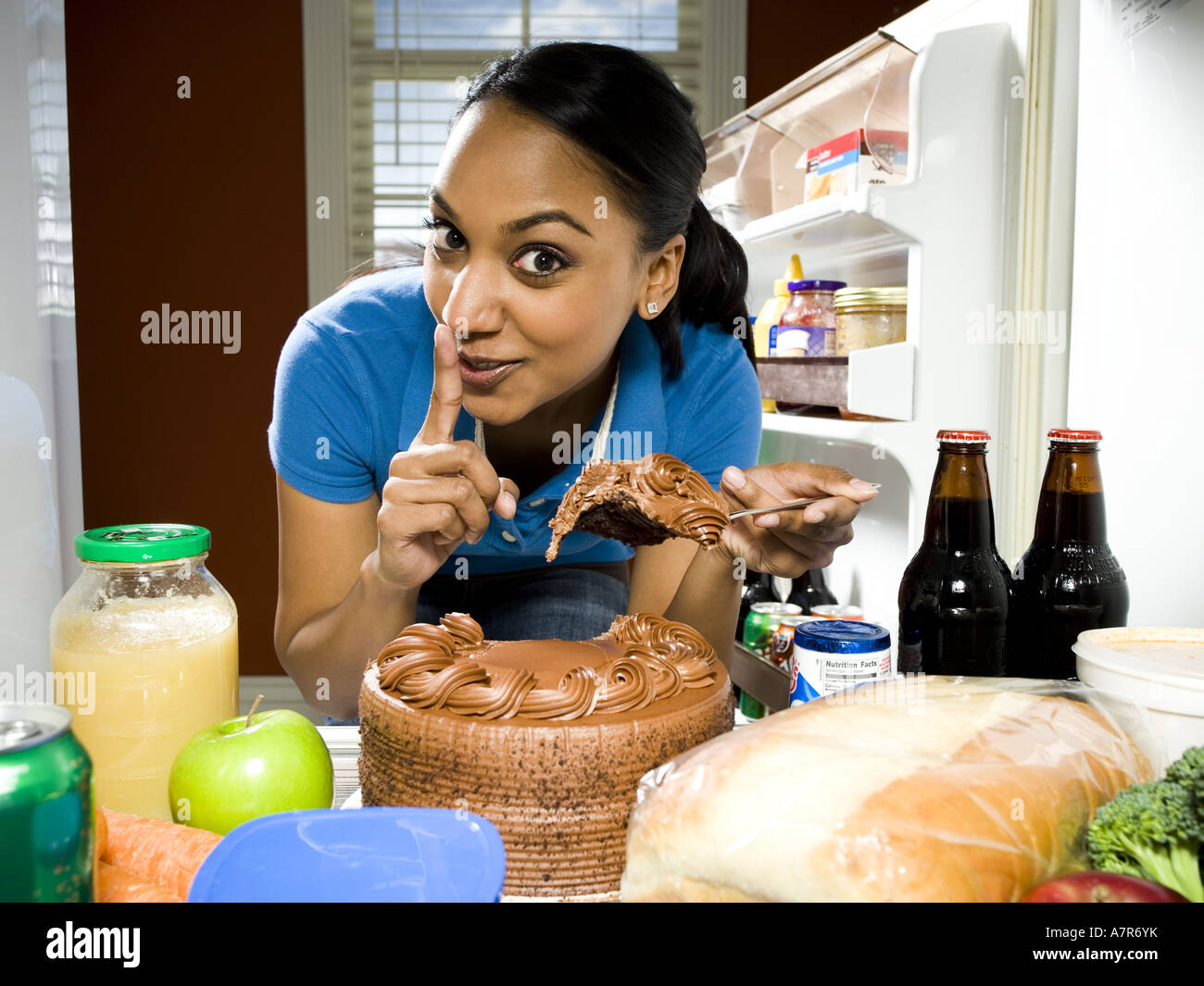 Woman eating sweets secretly hi-res stock photography and images - Alamy