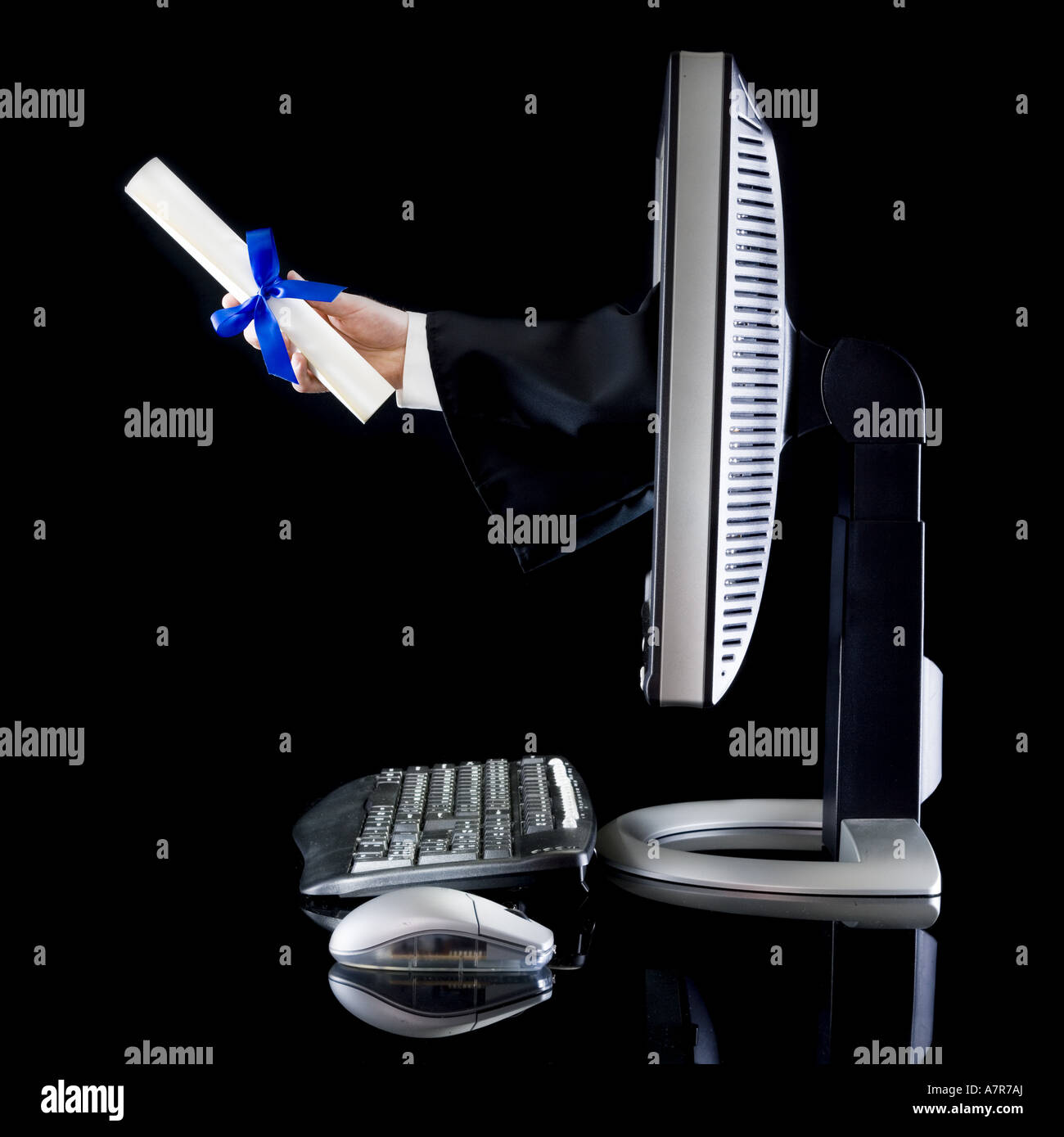 Side view of computer with hand coming through monitor holding diploma ...