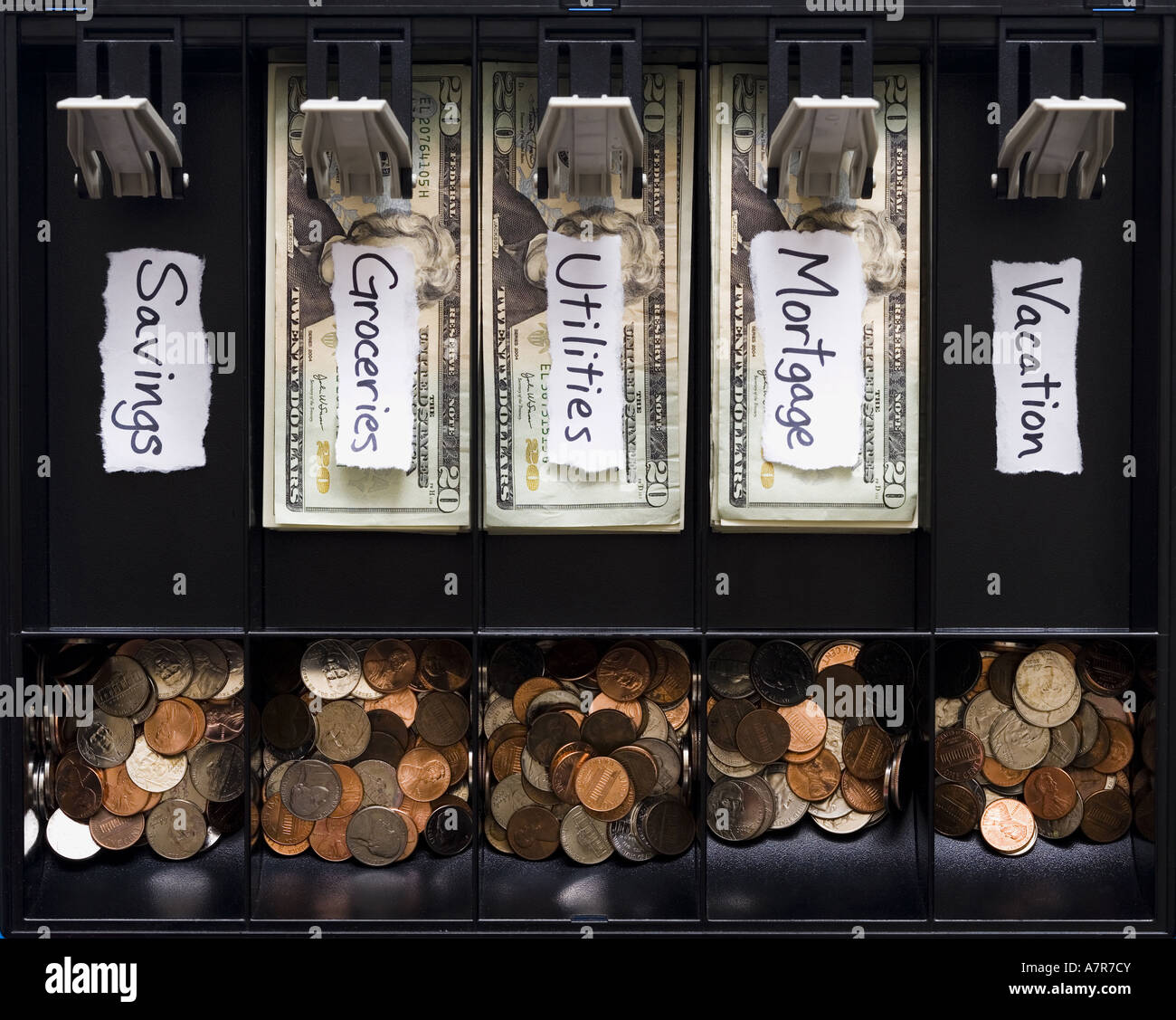 Detailed view of US currency and coins in till with labels for ...