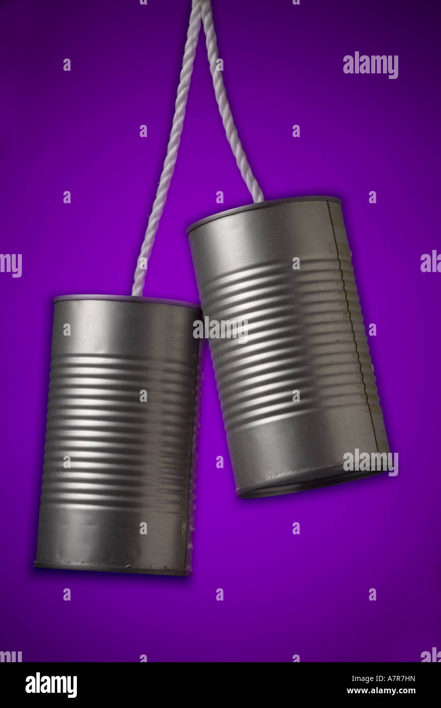 Two cans attached with rope Stock Photo - Alamy