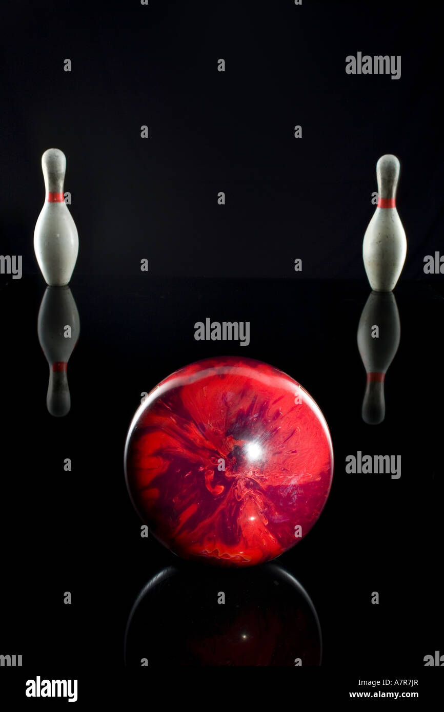 Two bowling pins and bowling ball Stock Photo - Alamy