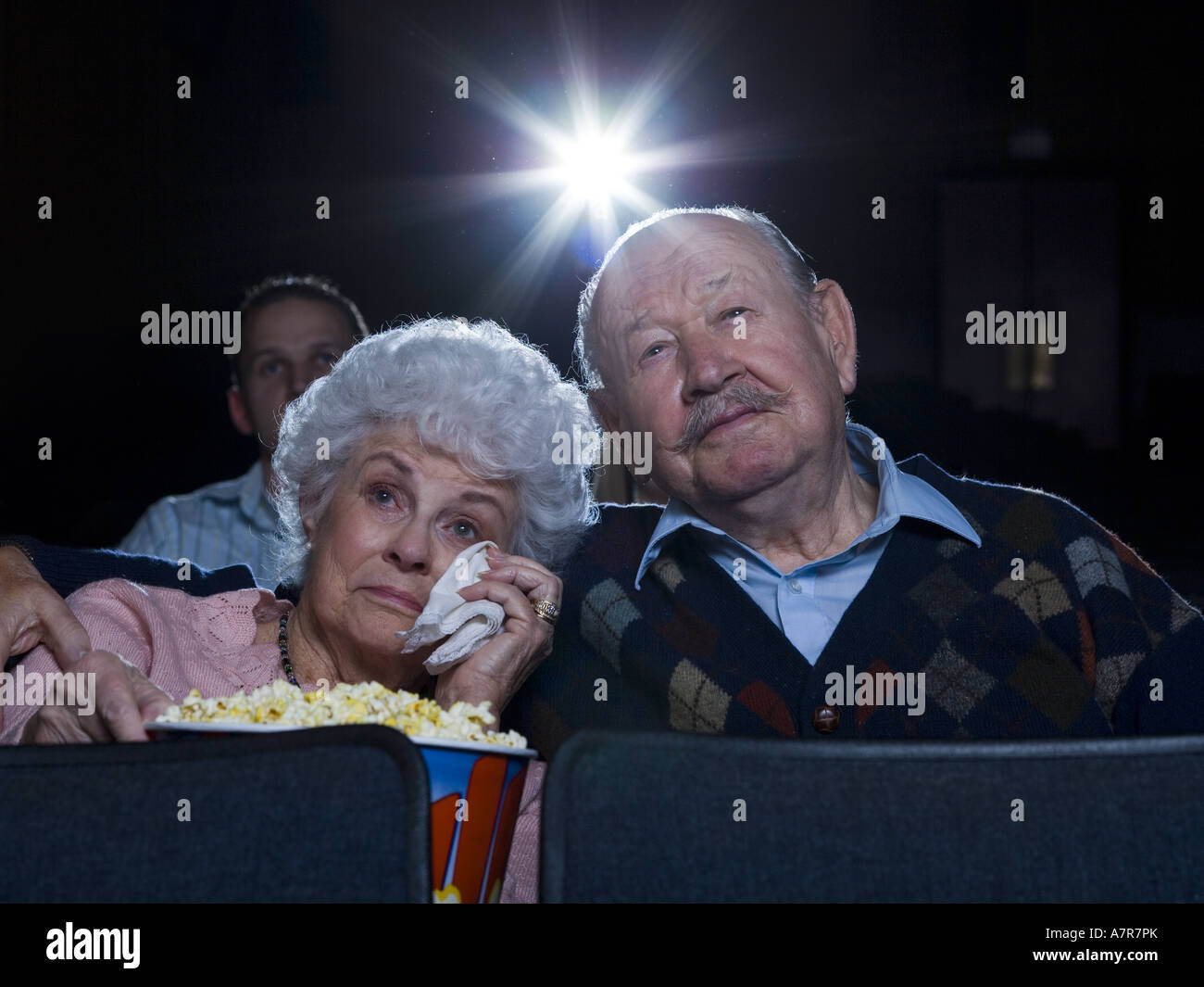 Man and woman watching movie in theater crying with popcorn Stock Photo ...