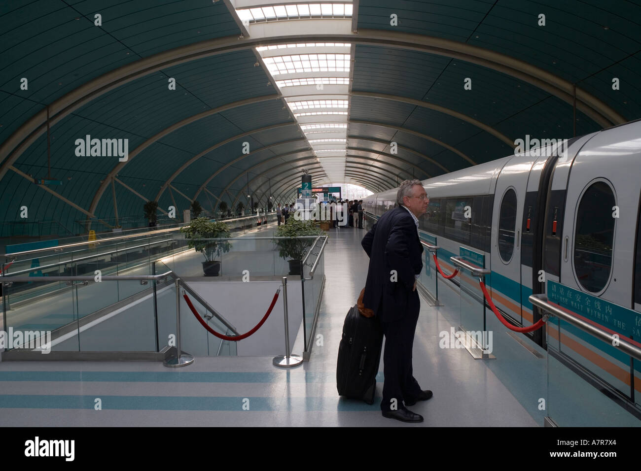 Asia China Shanghai Passenger waits to board first class section of ...