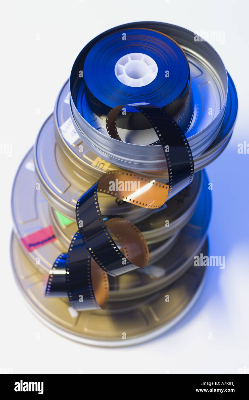 Film strip in pile of canisters Stock Photo - Alamy