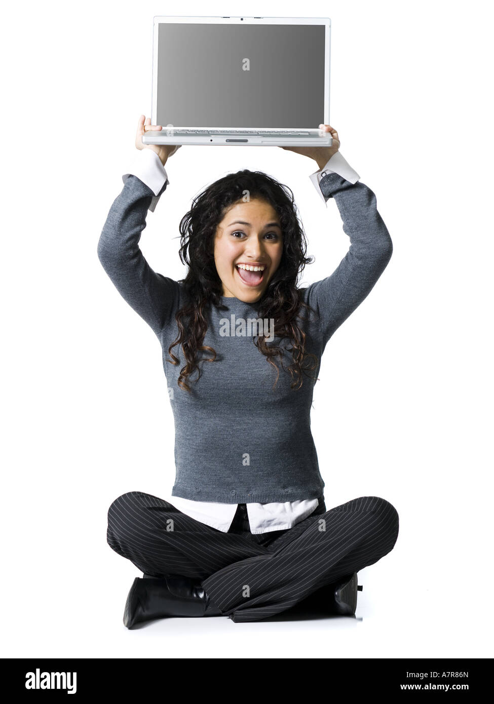 Silhouette young woman sitting cross legged hi-res stock photography ...