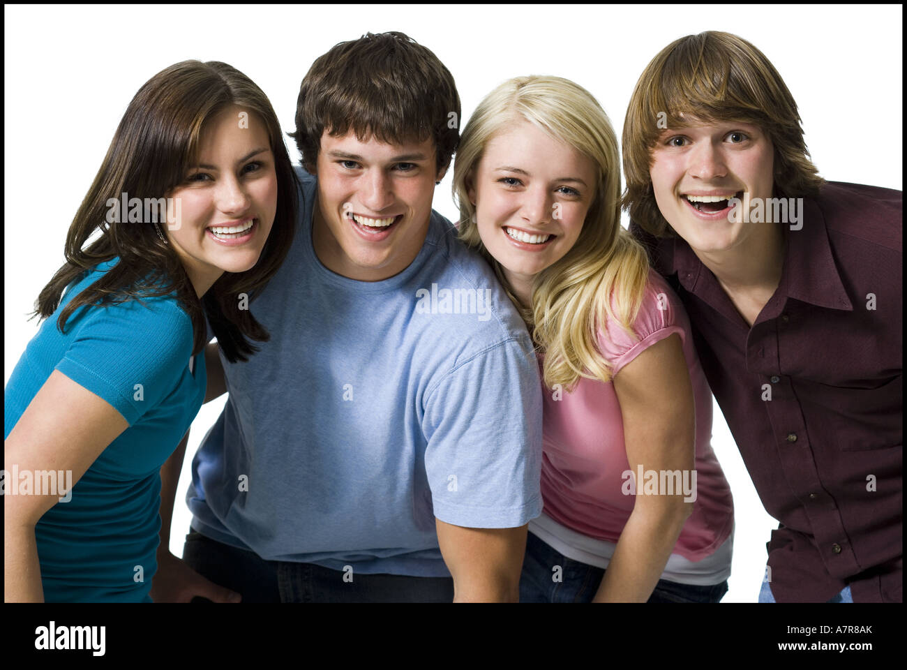 Four people smiling Stock Photo - Alamy
