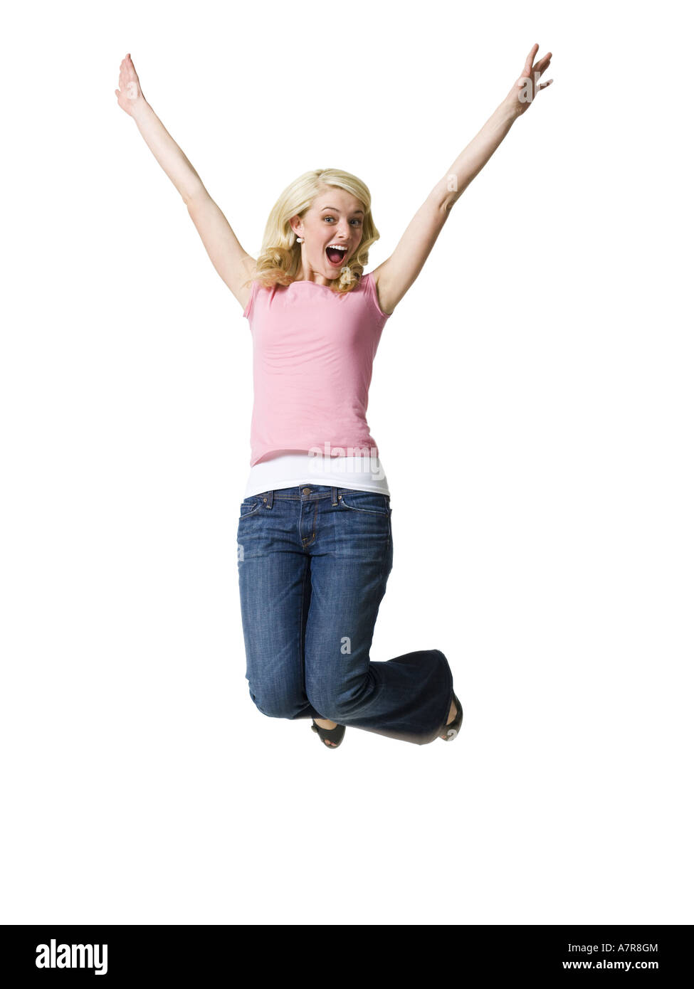 Woman jumping with arms up Stock Photo - Alamy