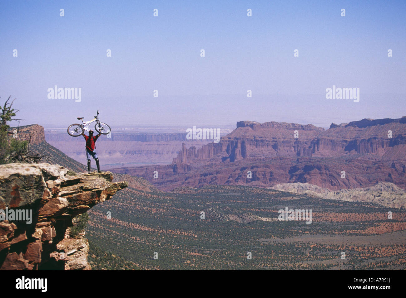 Man holding bike above head hi-res stock photography and images - Alamy
